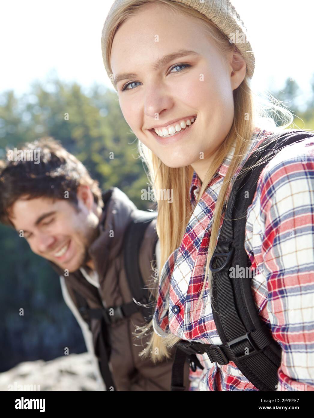 Nothing makes her smile more than time outdoors. A happy young couple ...