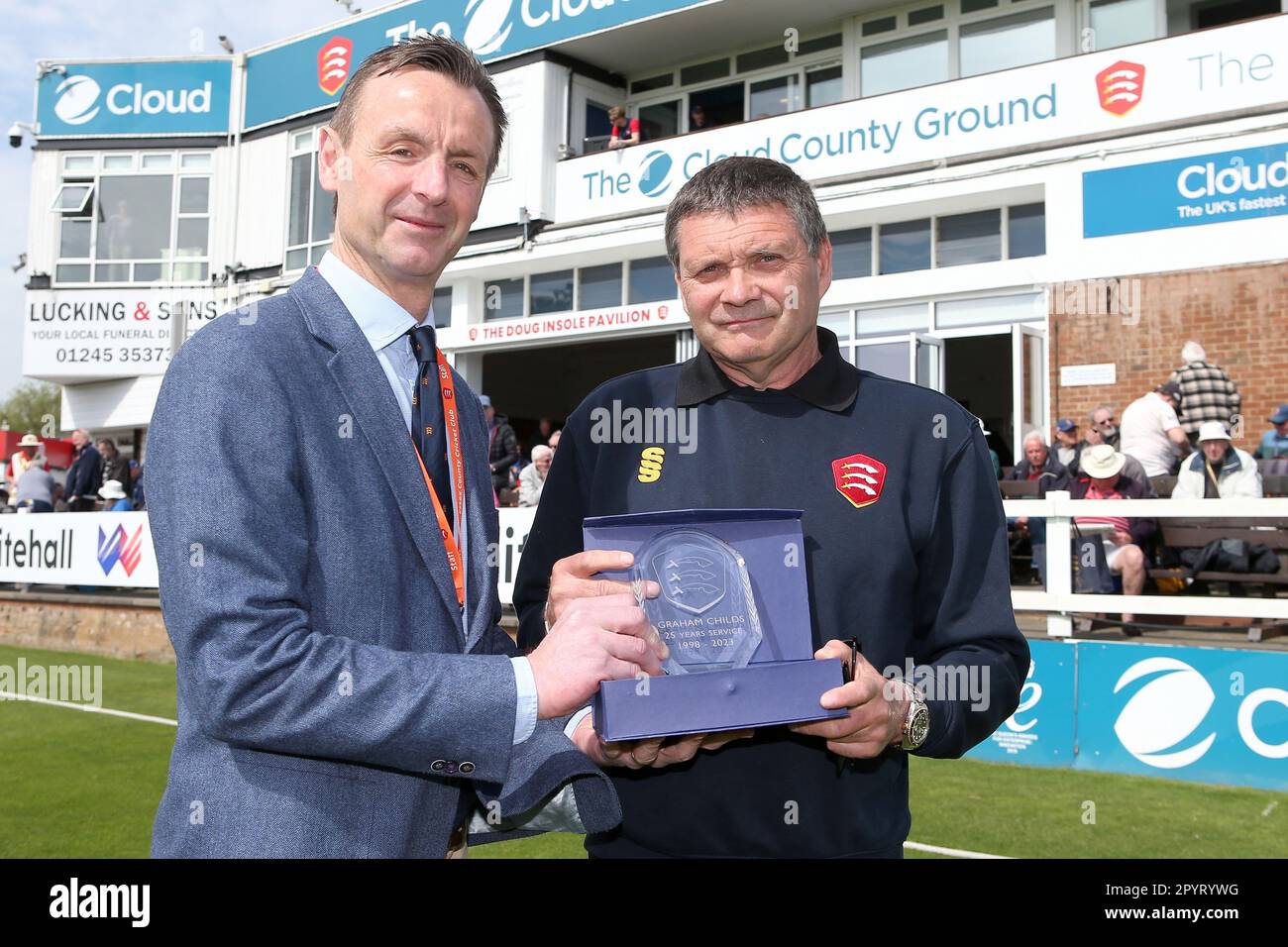 Graham Childs of Essex (R) receives a presentation to mark 25 years ...