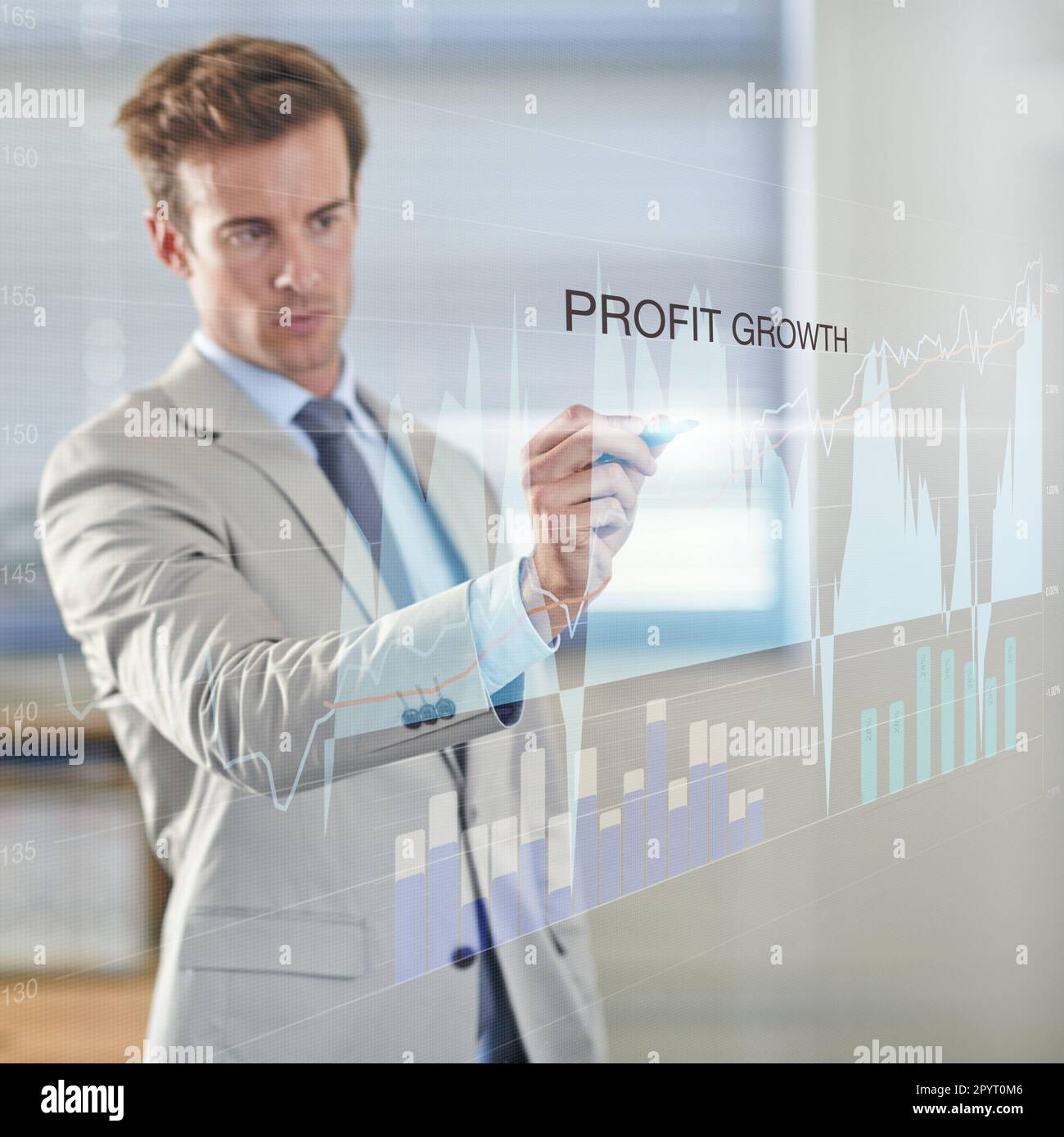 Expanding your profit margin. a businessman using a digital interface ...