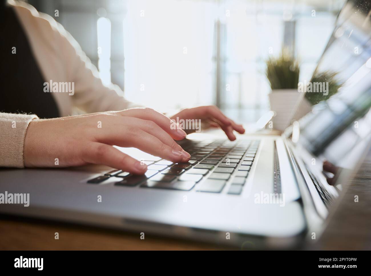 man hand printing jobs using a laptop keyboard at the office Stock ...