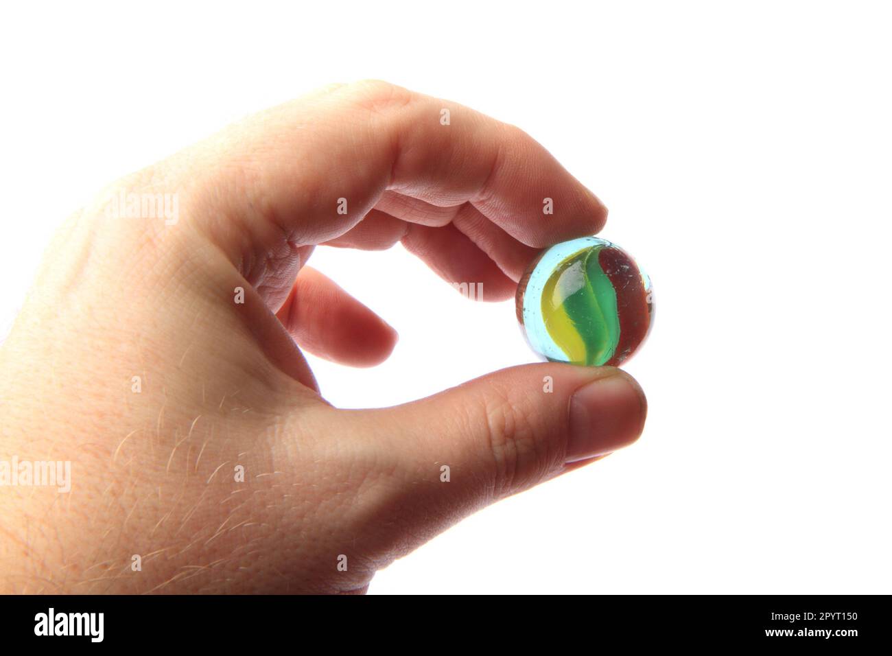color glass sphere in the human hand isolated on the white background ...