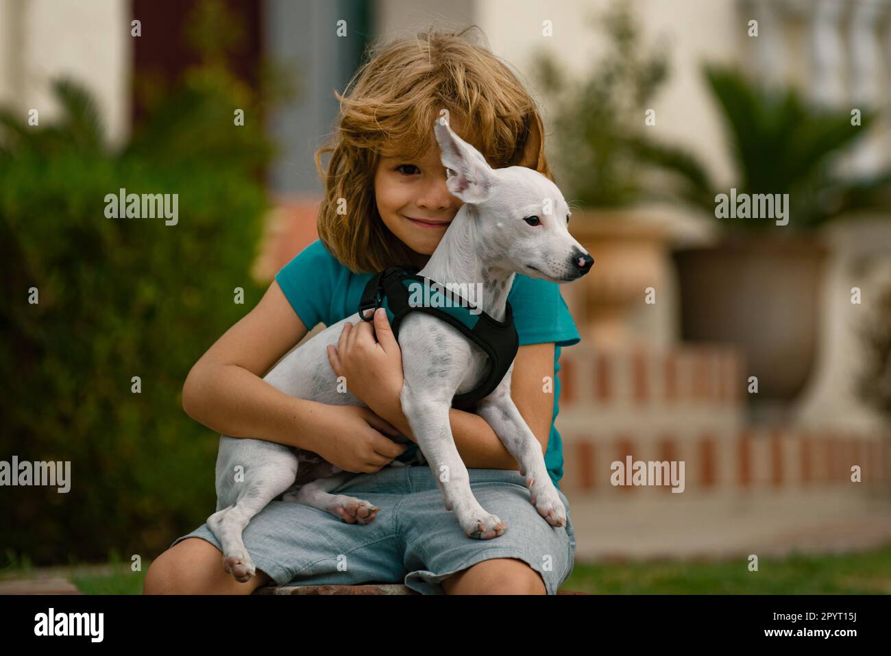 Kid boy hug puppy. Child with dog. Kid with puppy. Doggy lover Stock ...
