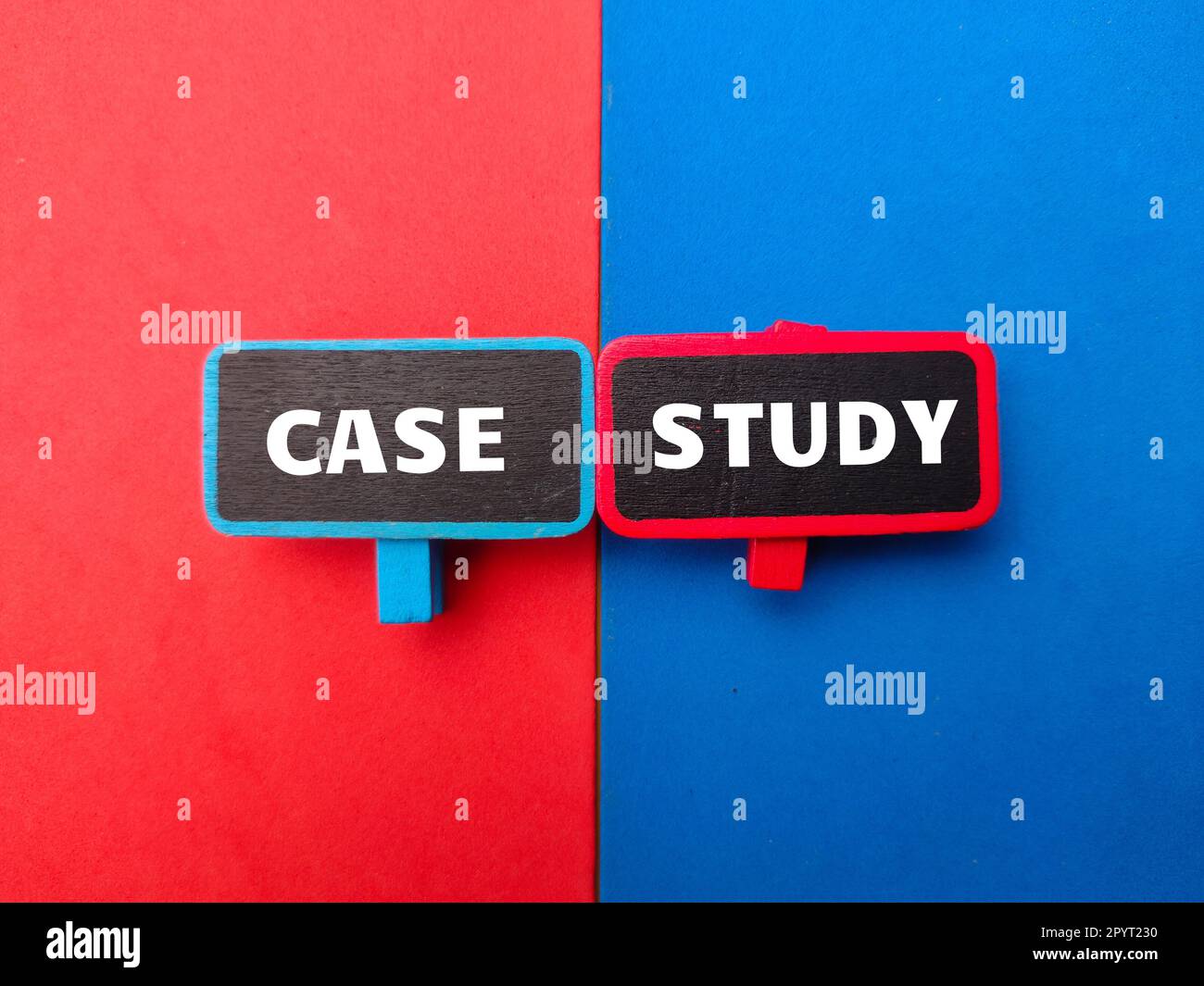 Colored wooden board with the word CASE STUDY on a red and blue ...