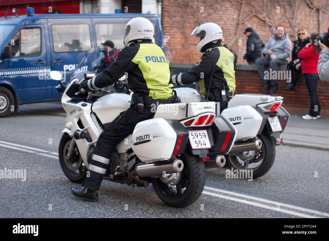Police, law enforcement and men on motorcycle in street with transport ...