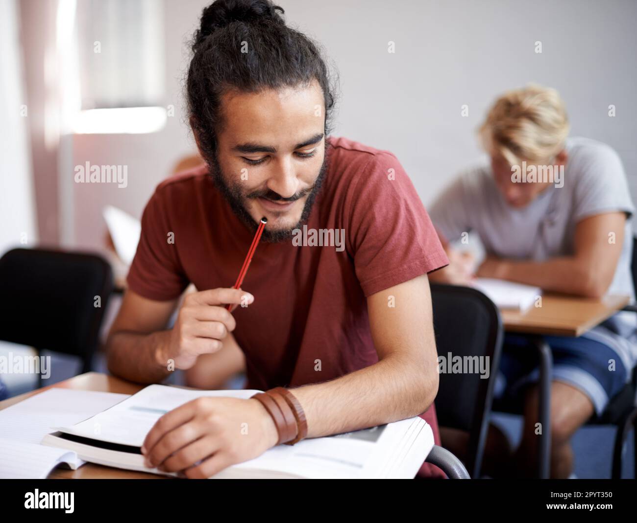 Multiethnic students writing test hi-res stock photography and images ...
