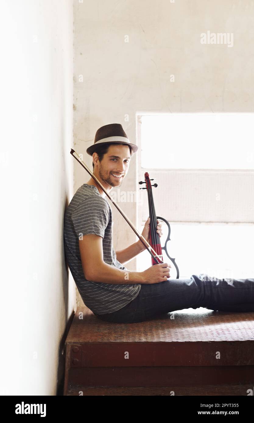 Portrait, musician and man with a violin, smile and training for a ...