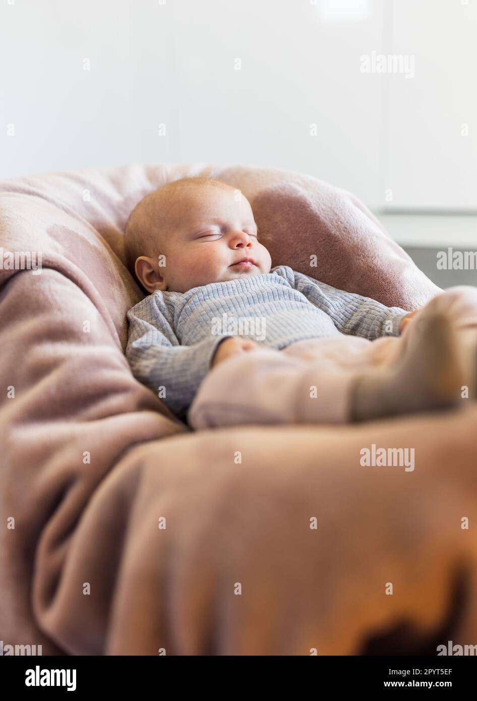 Cute newborn baby girl sleeping with satisfied expression on face in ...