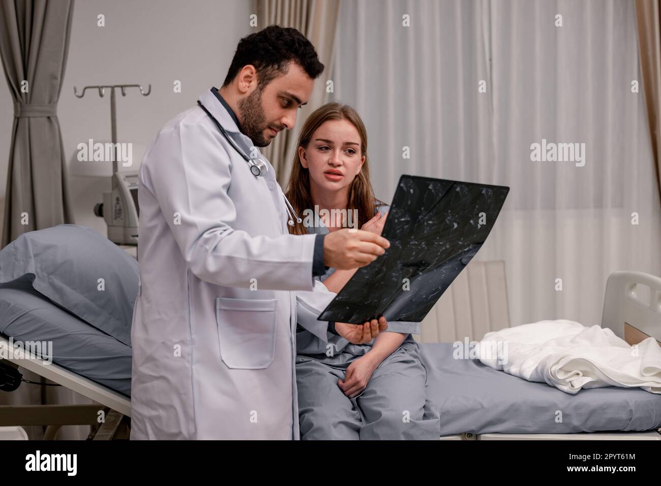 Physician and radiologist analyze medical images, including MRI film ...