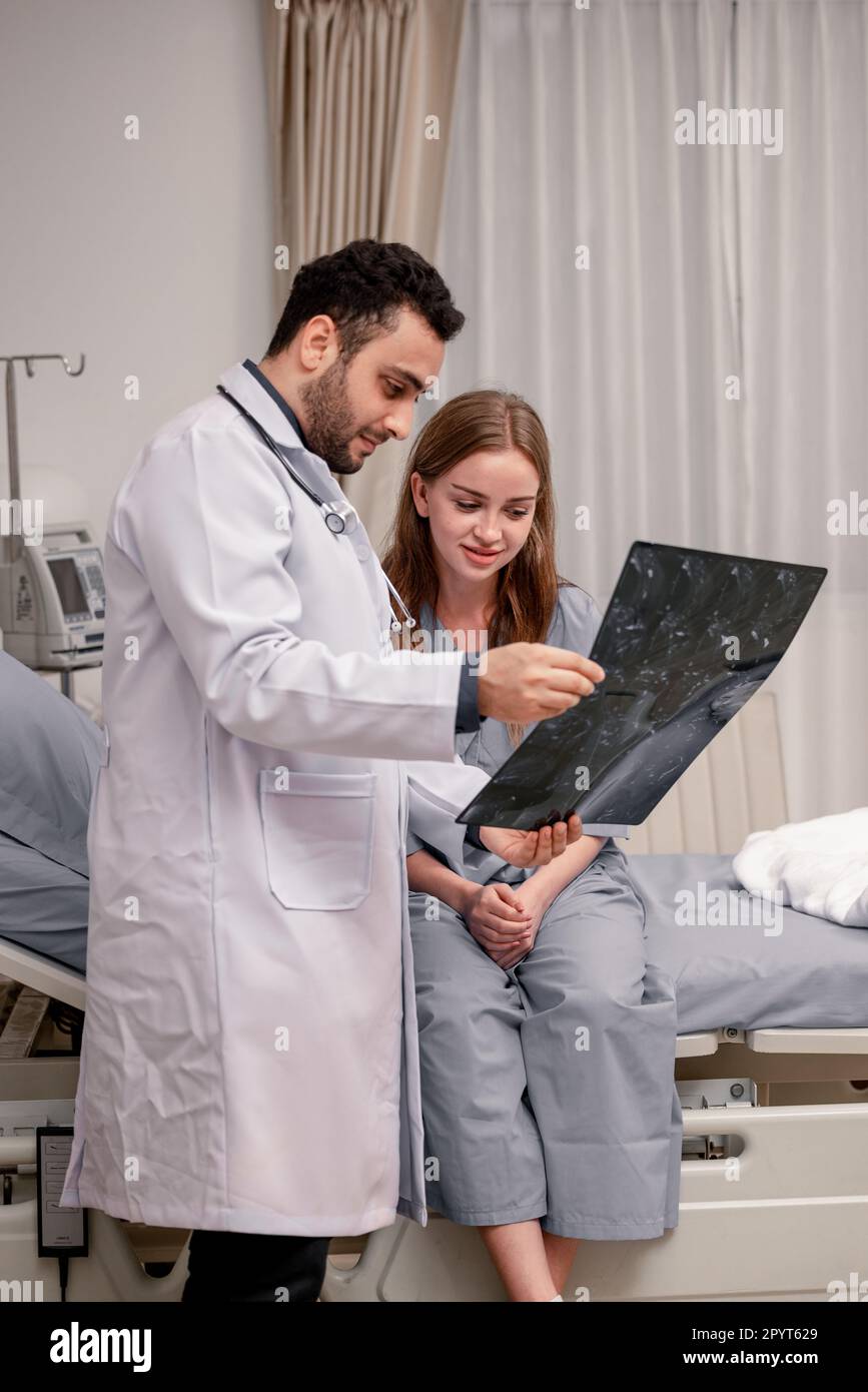 Physician and radiologist analyze medical images, including MRI film ...