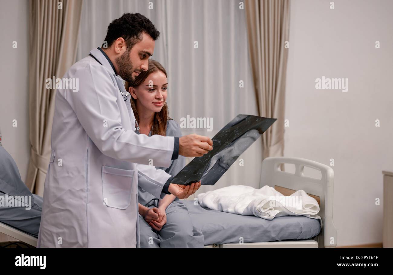 Physician and radiologist analyze medical images, including MRI film ...