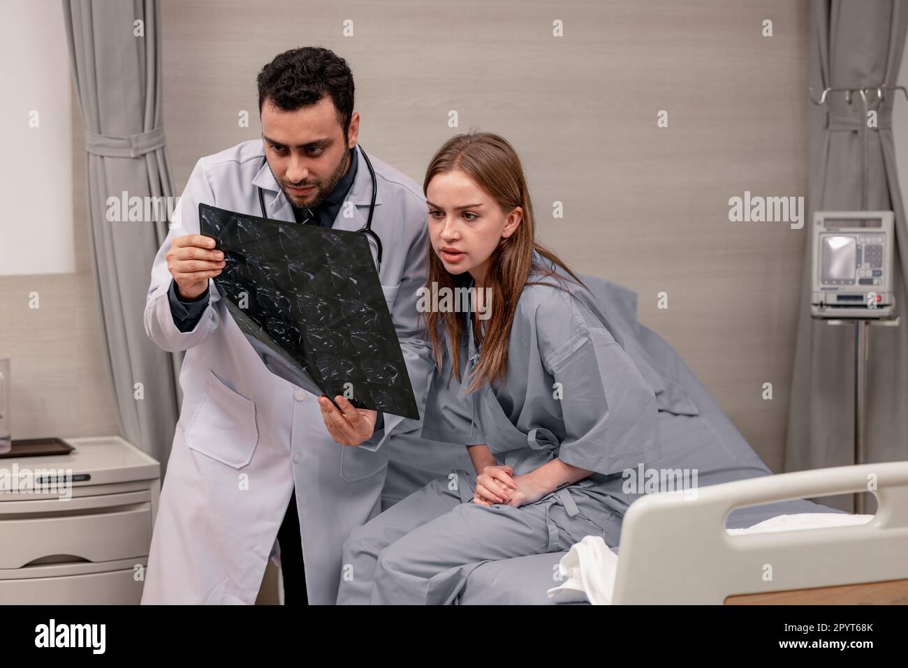 Physician and radiologist analyze medical images, including MRI film ...