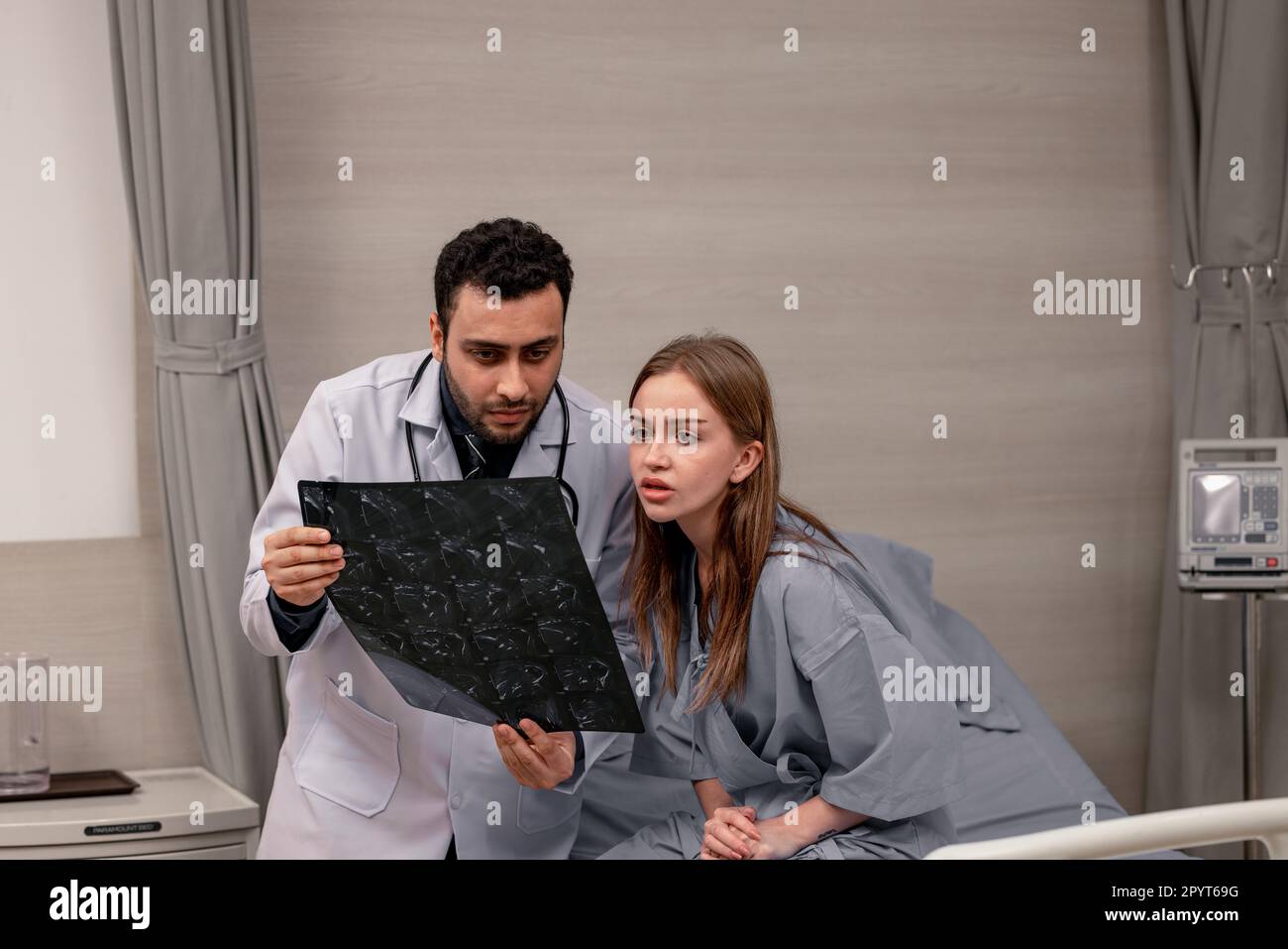 Physician and radiologist analyze medical images, including MRI film ...