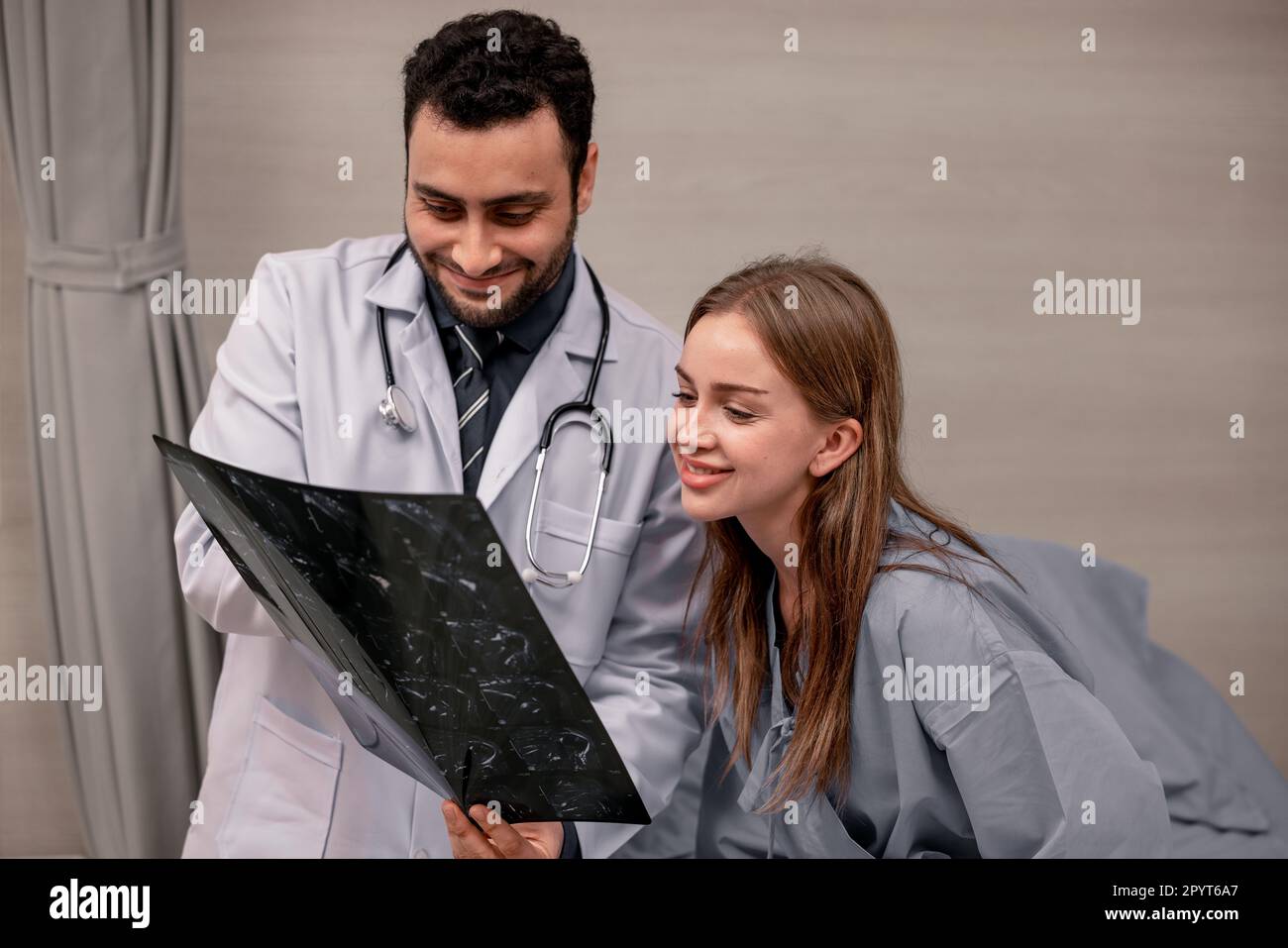 Physician and radiologist analyze medical images, including MRI film ...