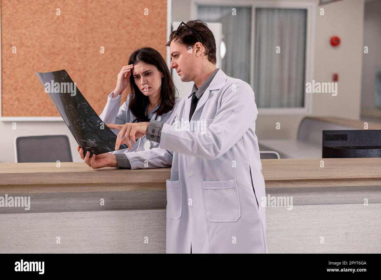 Physician and radiologist analyze medical images, including MRI film ...