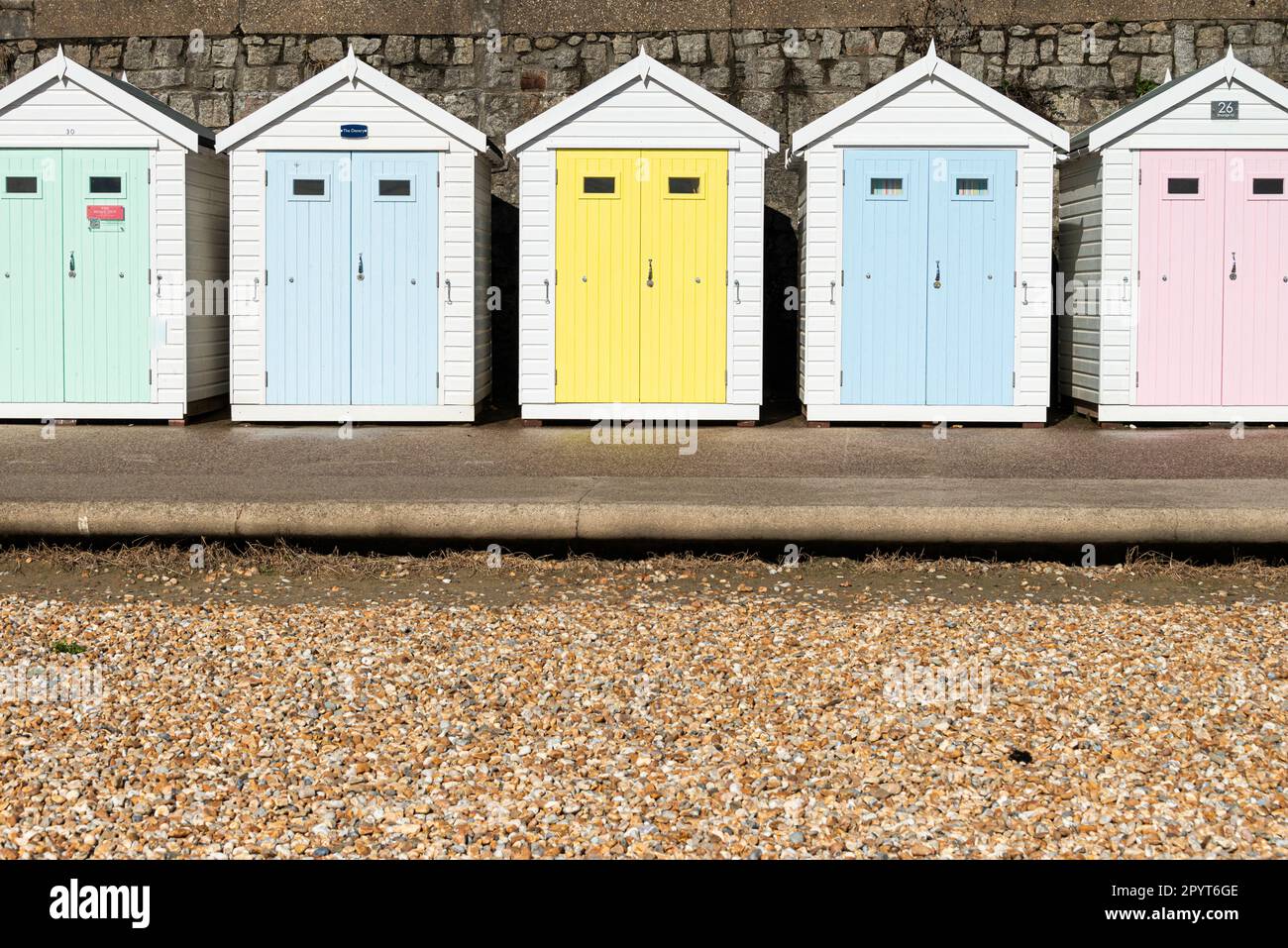 Pastel coloured beach huts on the sea front by Front beach, Lyme Regis ...