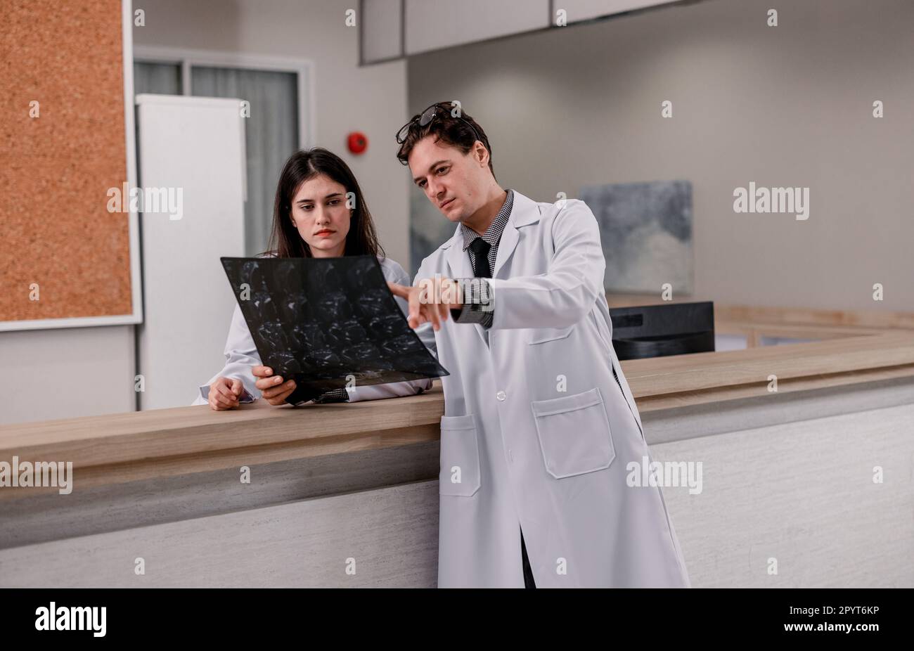 Physician and radiologist analyze medical images, including MRI film ...