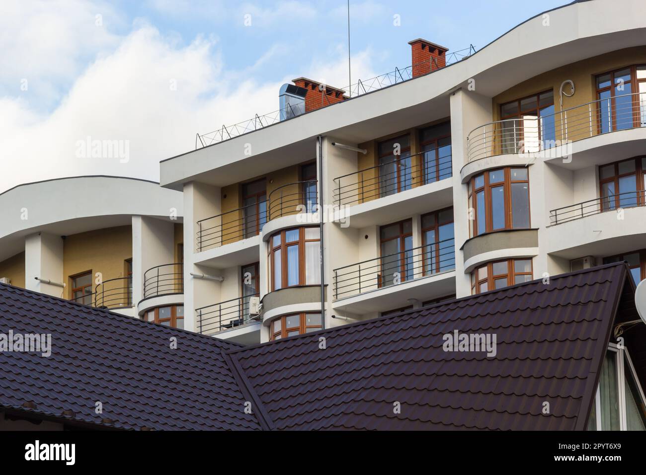 Architectural details of modern high apartment building facade with ...