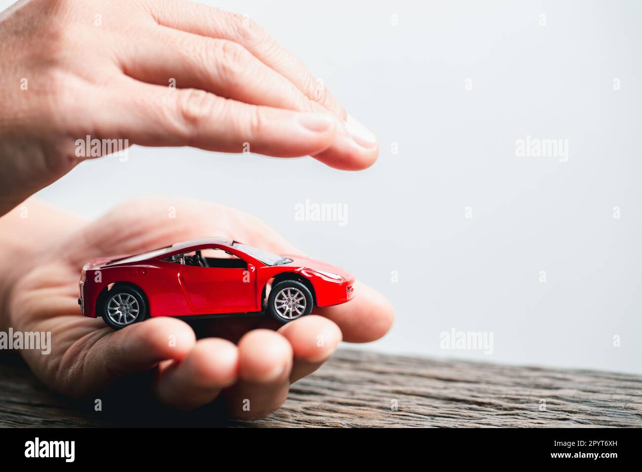 Female hands and car as protection of car concept. Woman insurance ...