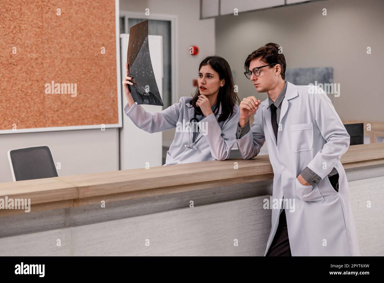 Physician and radiologist analyze medical images, including MRI film ...