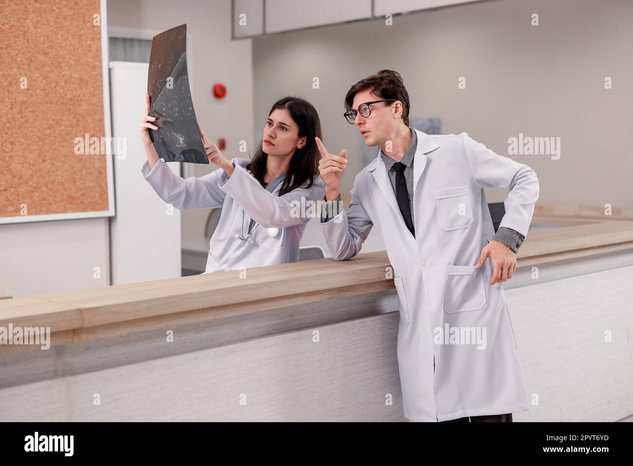 Physician and radiologist analyze medical images, including MRI film ...