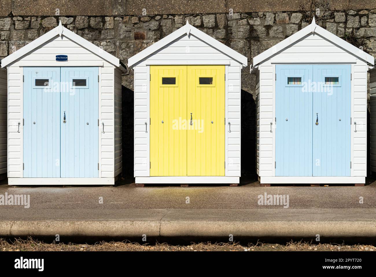 Pastel coloured beach huts on the sea front by Front beach, Lyme Regis ...