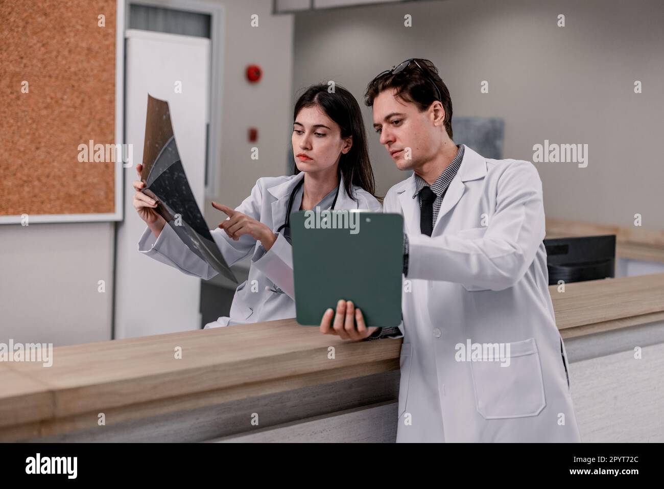 Physician and radiologist analyze medical images, including MRI film ...