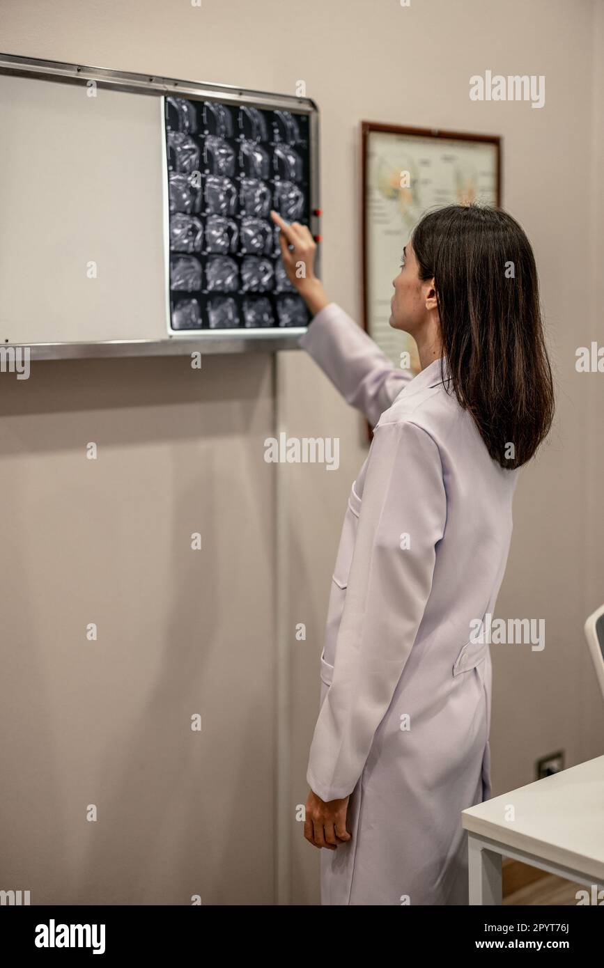Physician and radiologist analyze medical images, including MRI film ...