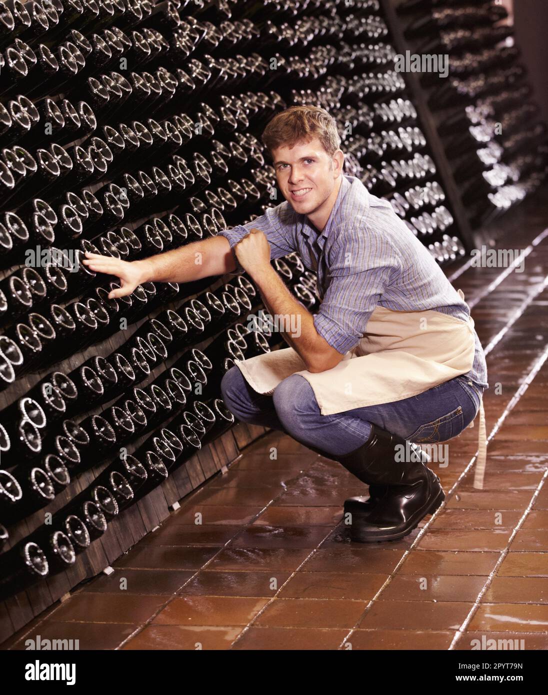 Portrait, man and counting bottles of wine in cellar, warehouse or ...