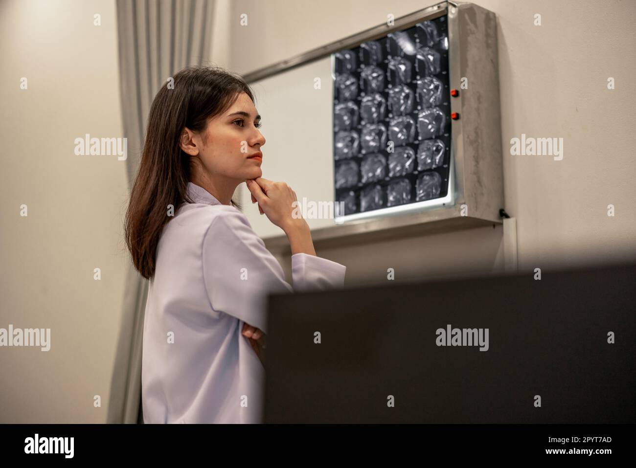 Physician and radiologist analyze medical images, including MRI film ...