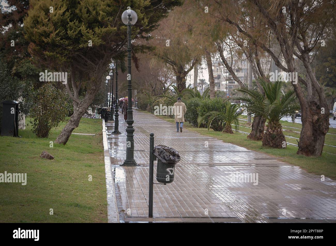Pedestrian street at a rainy autumnal day. Greece Stock Photo - Alamy