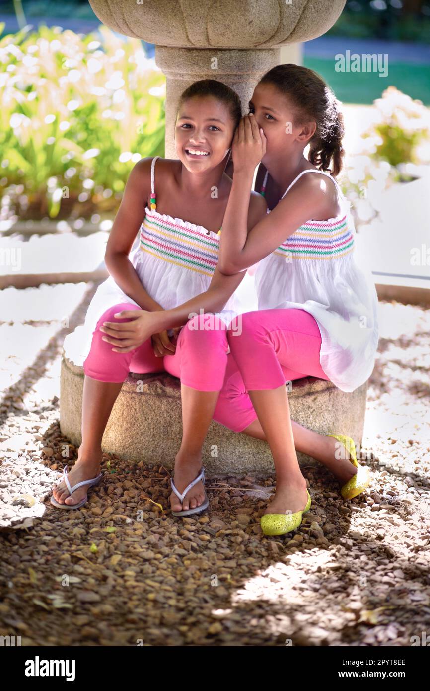 Children, friends or sisters outdoor for secret while playing, whisper ...