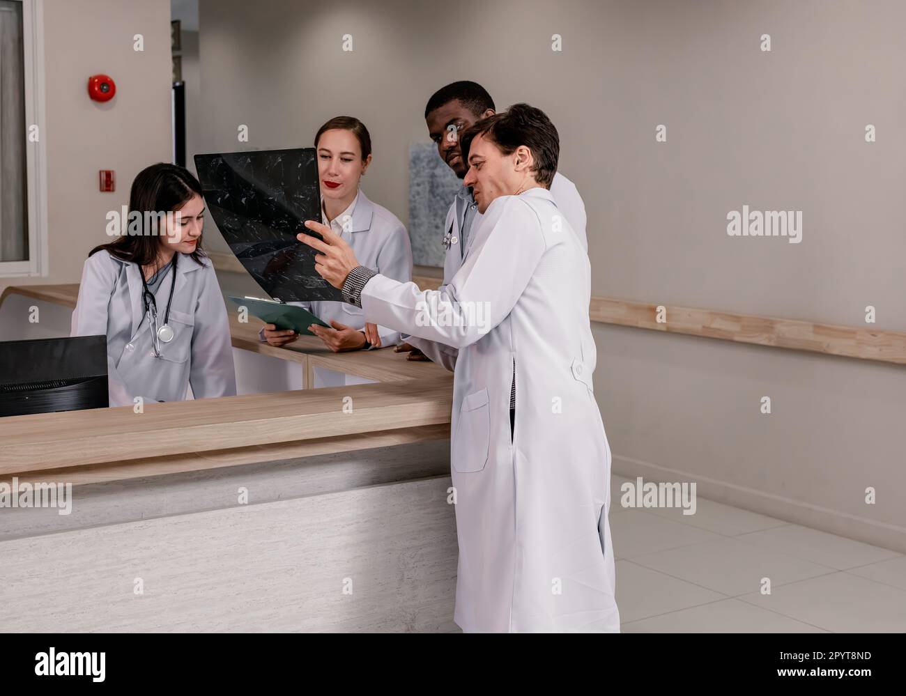 Physician and radiologist analyze medical images, including MRI film ...