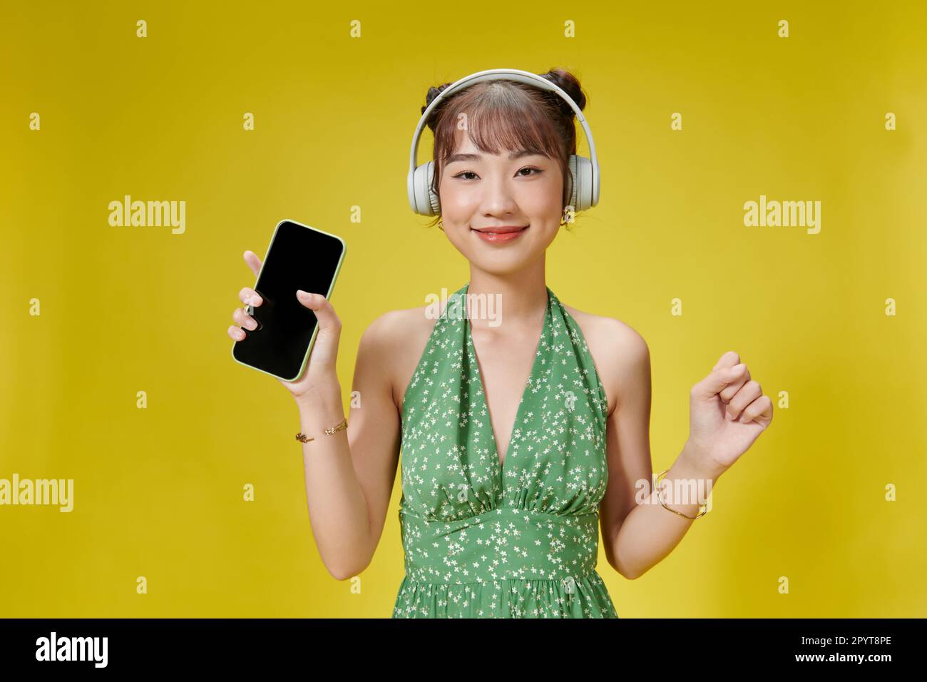 Asian lady singing favorite song and using cell phone as a mic Stock ...