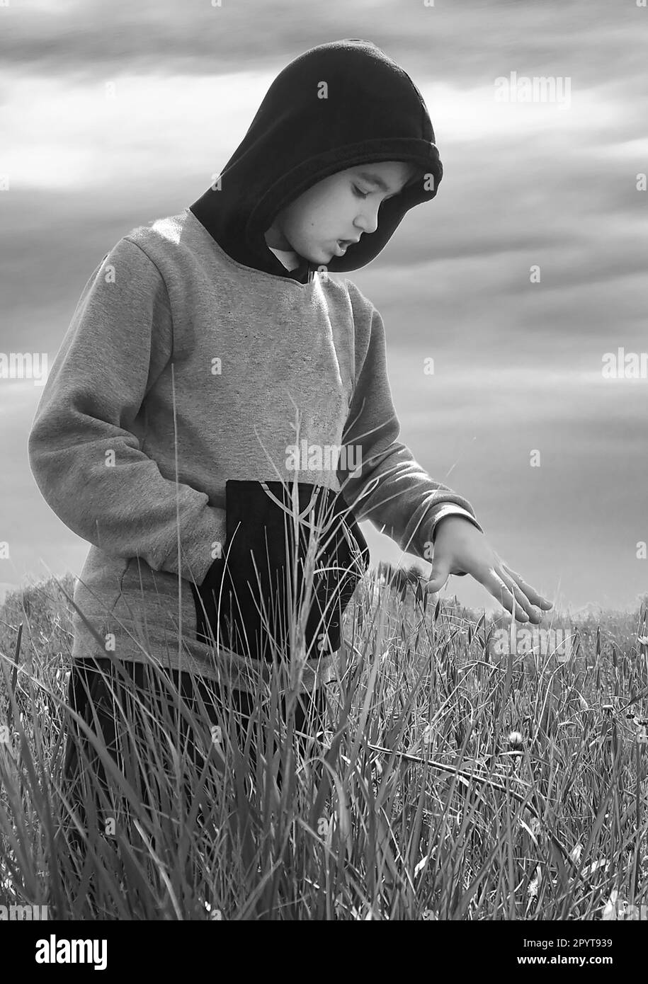 Boy looking down Black and White Stock Photos & Images - Alamy