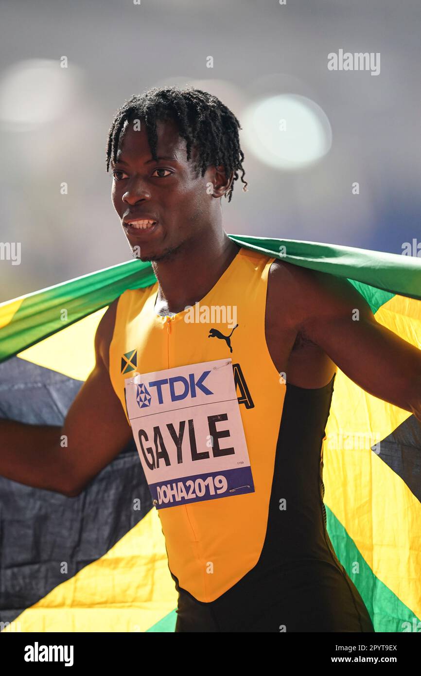 Tajay Gayle with her country's flag after medaling in the long jump at ...