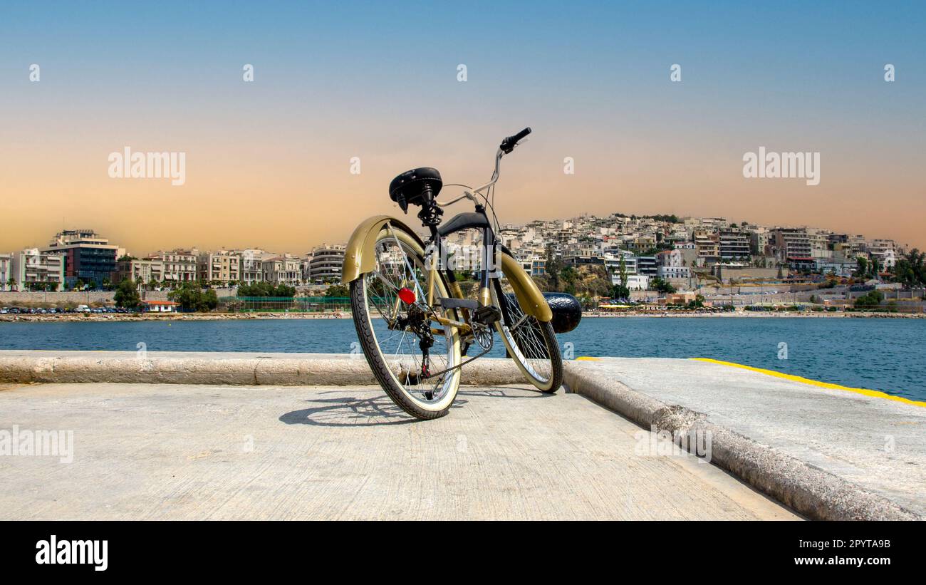 Vintage style bicycle standing on Pier of marina Zeas, opposite ...
