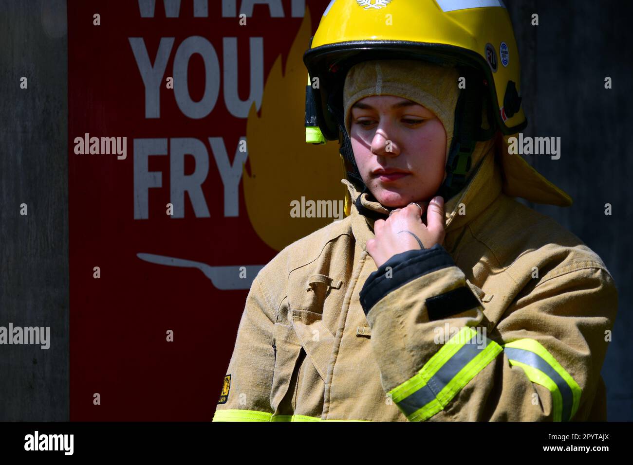 Auckland, New Zealand - Mar 2023. Portrait of a young fire fighter ...