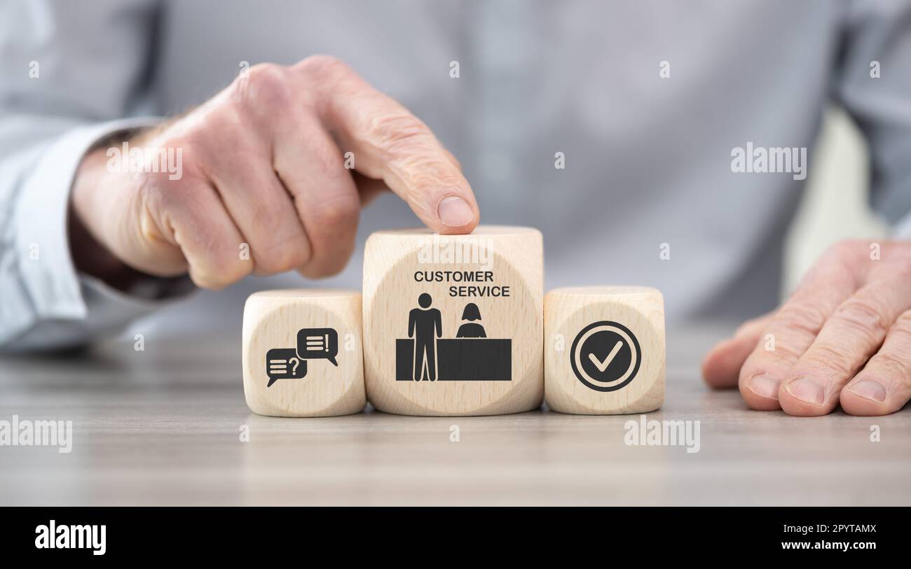 Wooden blocks with symbol of customer service concept Stock Photo - Alamy