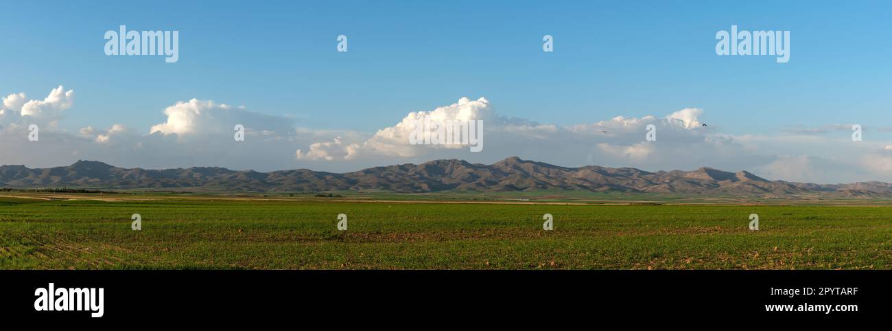 A landscape of nature on a cloudy spring day including mountains and ...