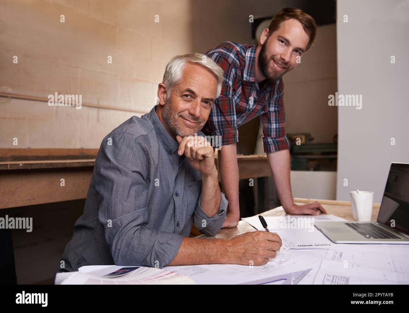 Turning his vision into reality. An architect drawing up plans Stock ...