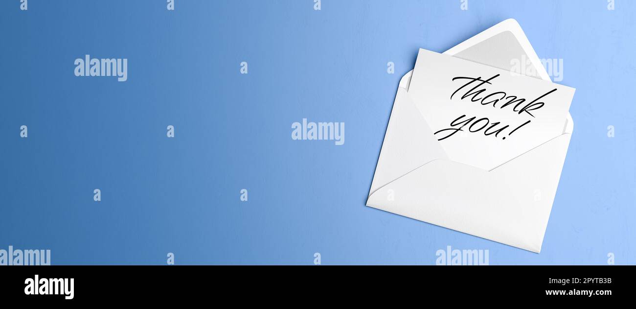 Letter with the text "Thank you" in an envelope on blue table ...