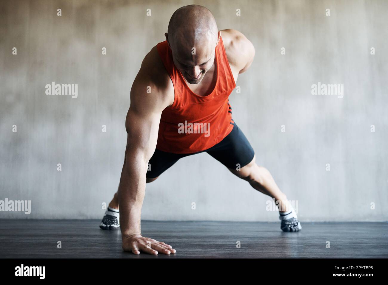 Fitness, strong man and one arm push up for gym studio exercise ...