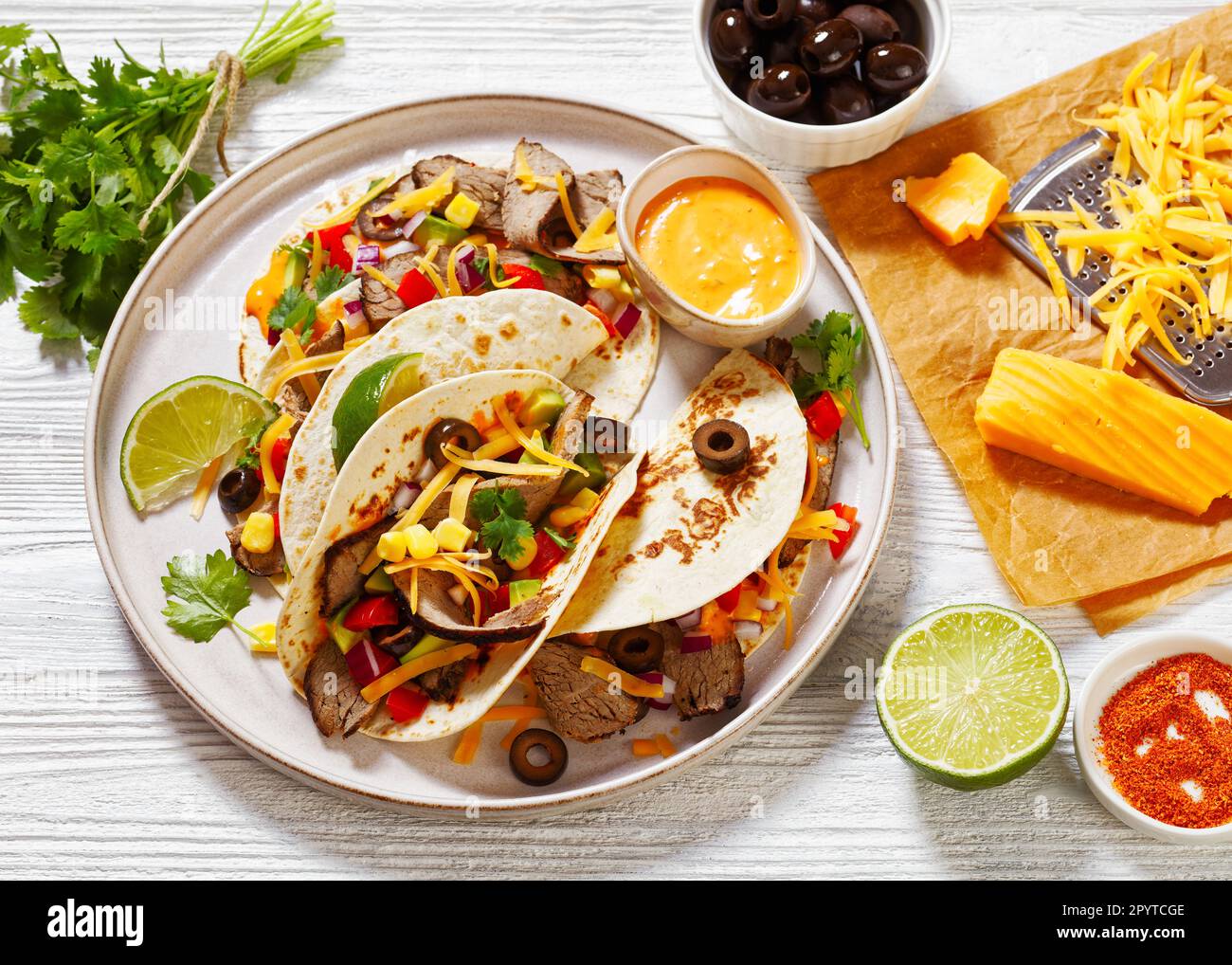 Grilled Steak Tacos with olives, tomatoes, red onion, avocado, cilantro ...
