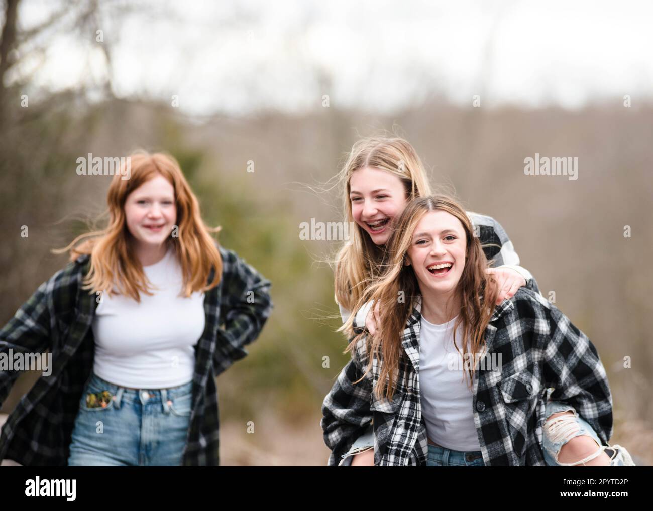 Three beautiful teen girls having fun together outdoors Stock Photo - Alamy