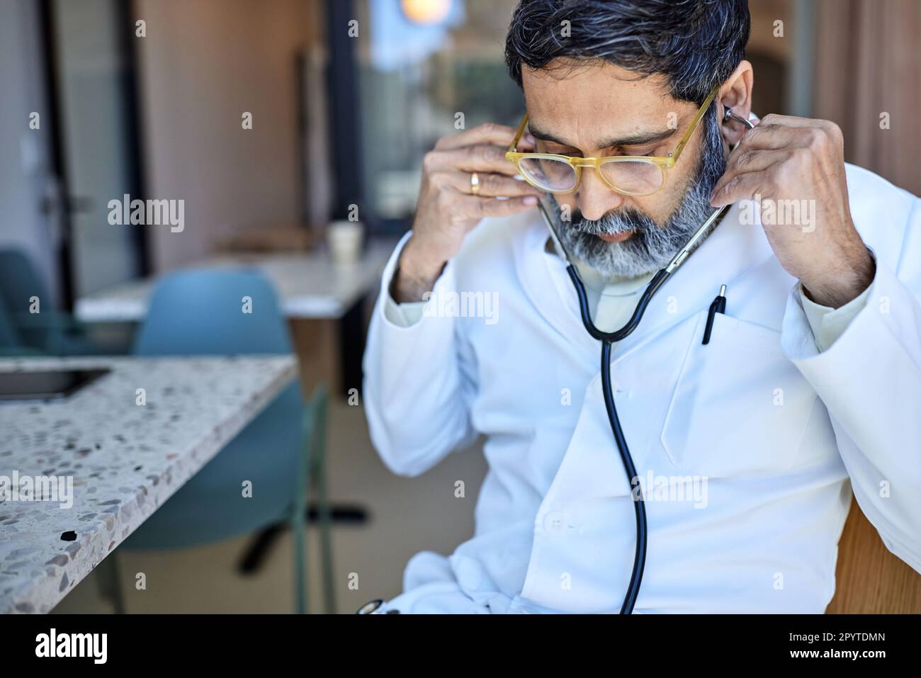 Male indian doctor holding hi-res stock photography and images - Alamy