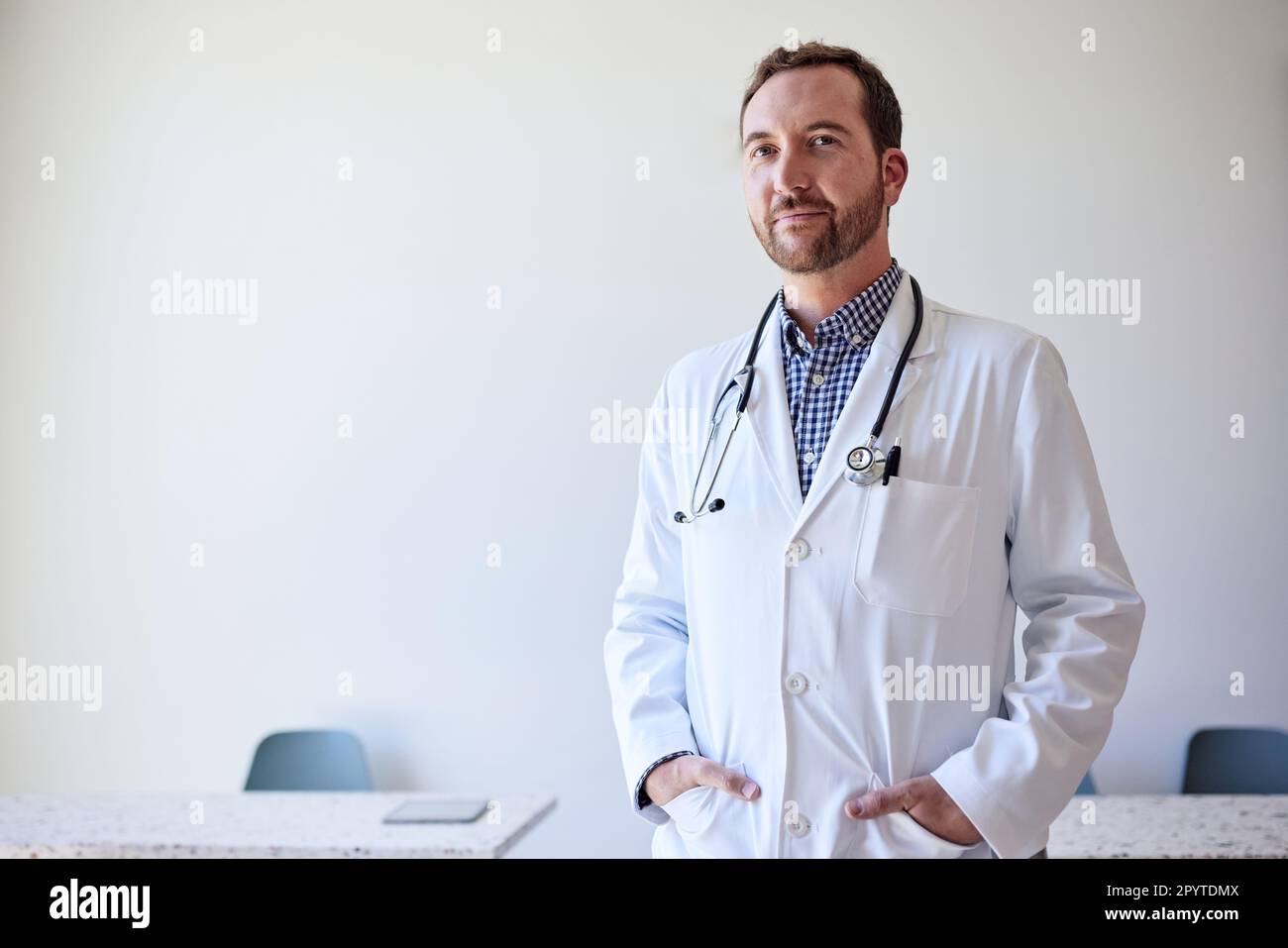 Portrait of male healthcare worker with hands in pockets Stock Photo ...