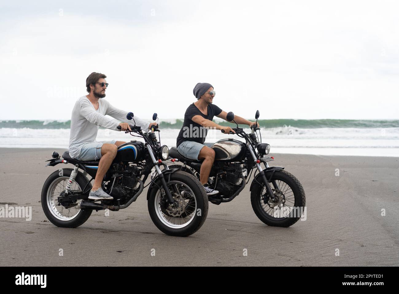 Man sitting on motorcycle at beach hi-res stock photography and images ...