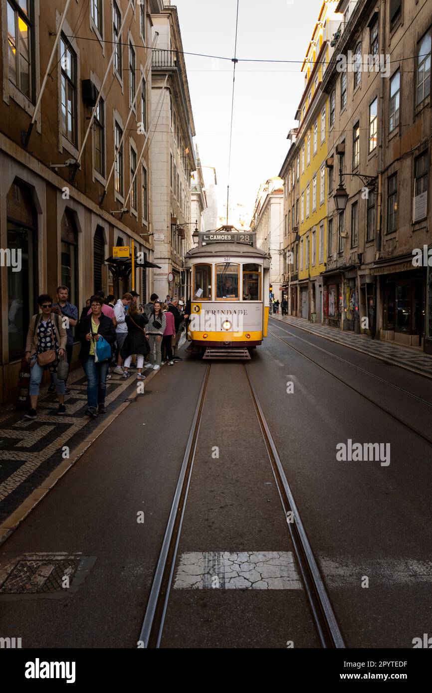 Beautiful view to old historic traditional yellow tram in Baixa area ...