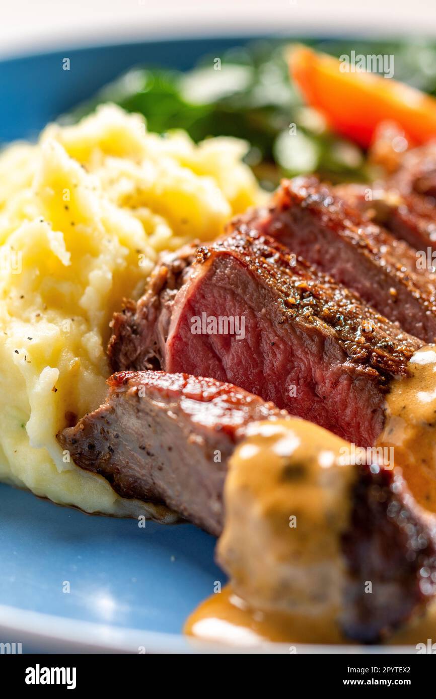 A delicious steak with mashed potato Stock Photo - Alamy