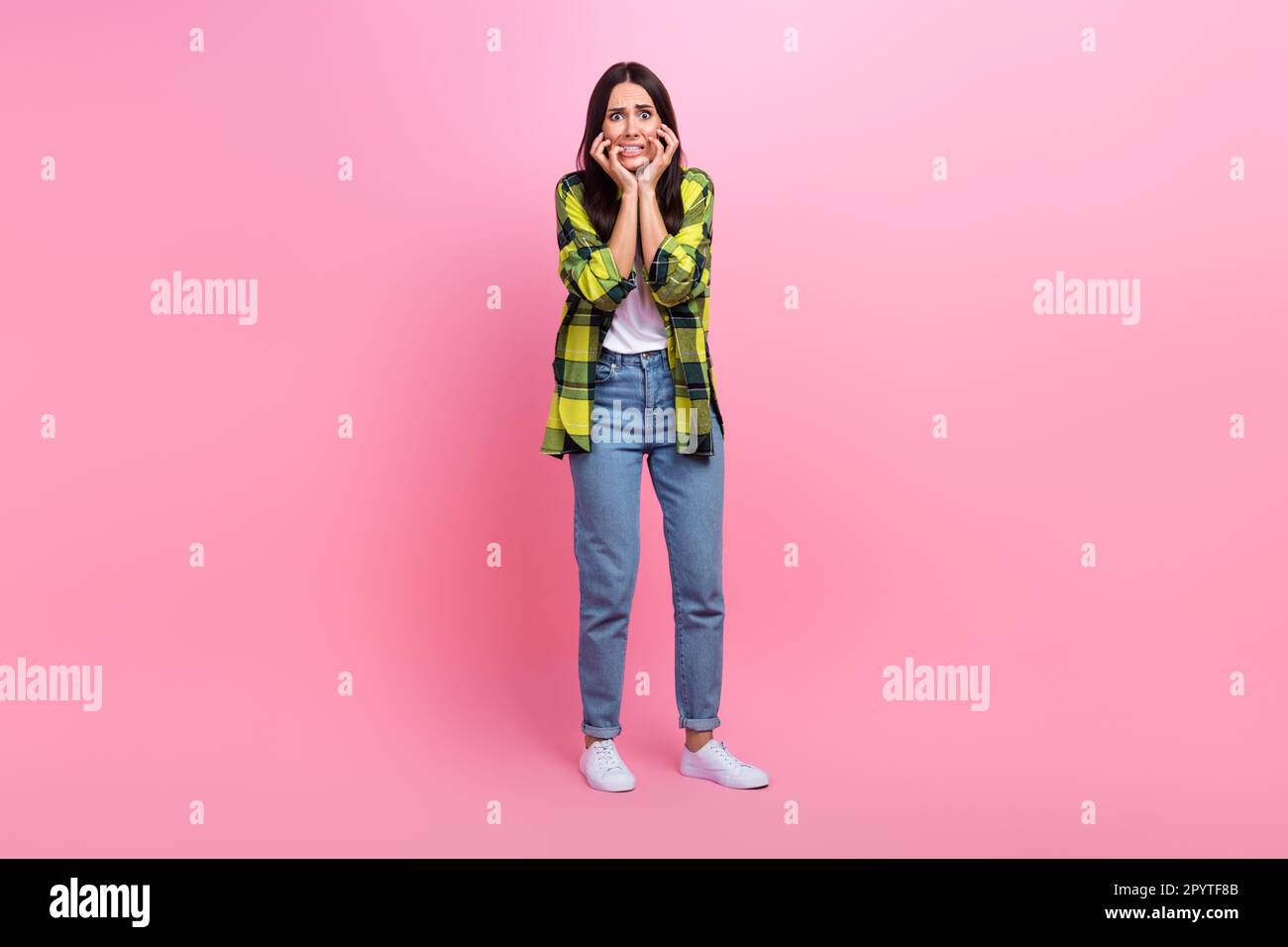 Full length photo of scared terrified lady wear checkered jacket biting ...